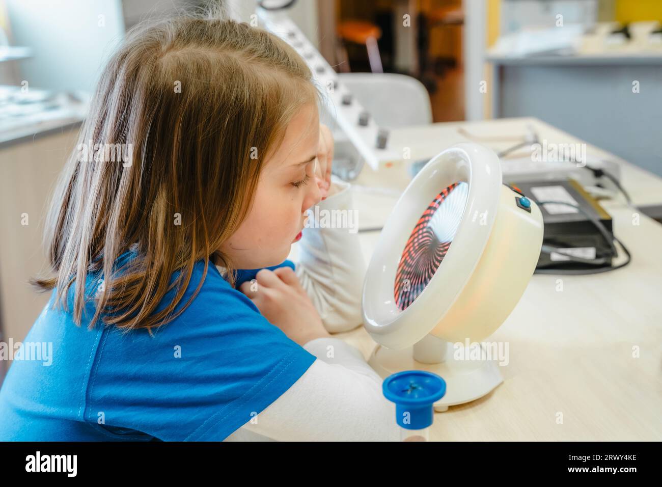 Little girl in medical office undergoing advanced laser vision ...