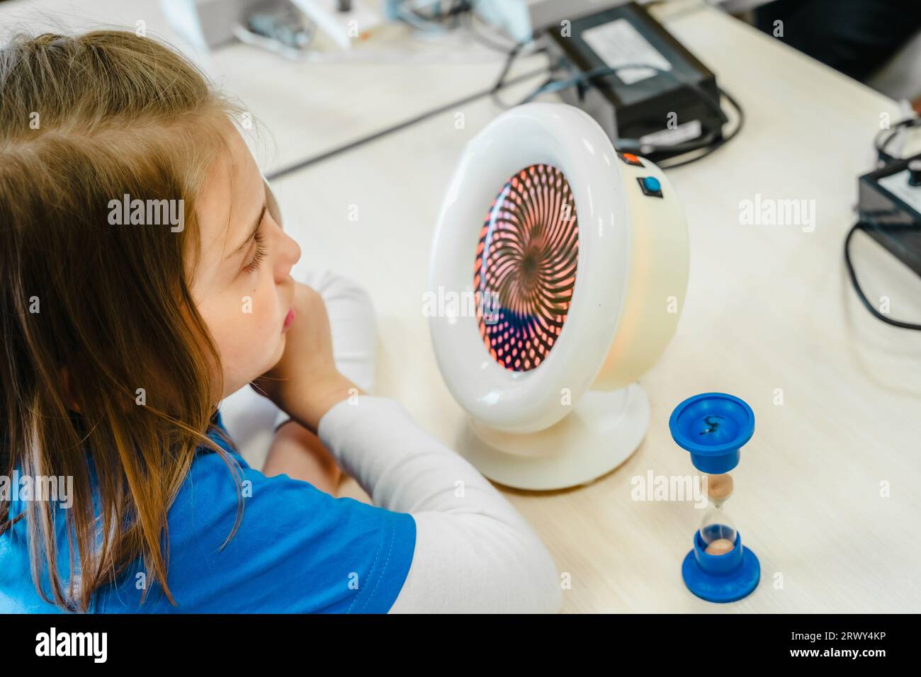 Little girl in medical office undergoing advanced laser vision ...