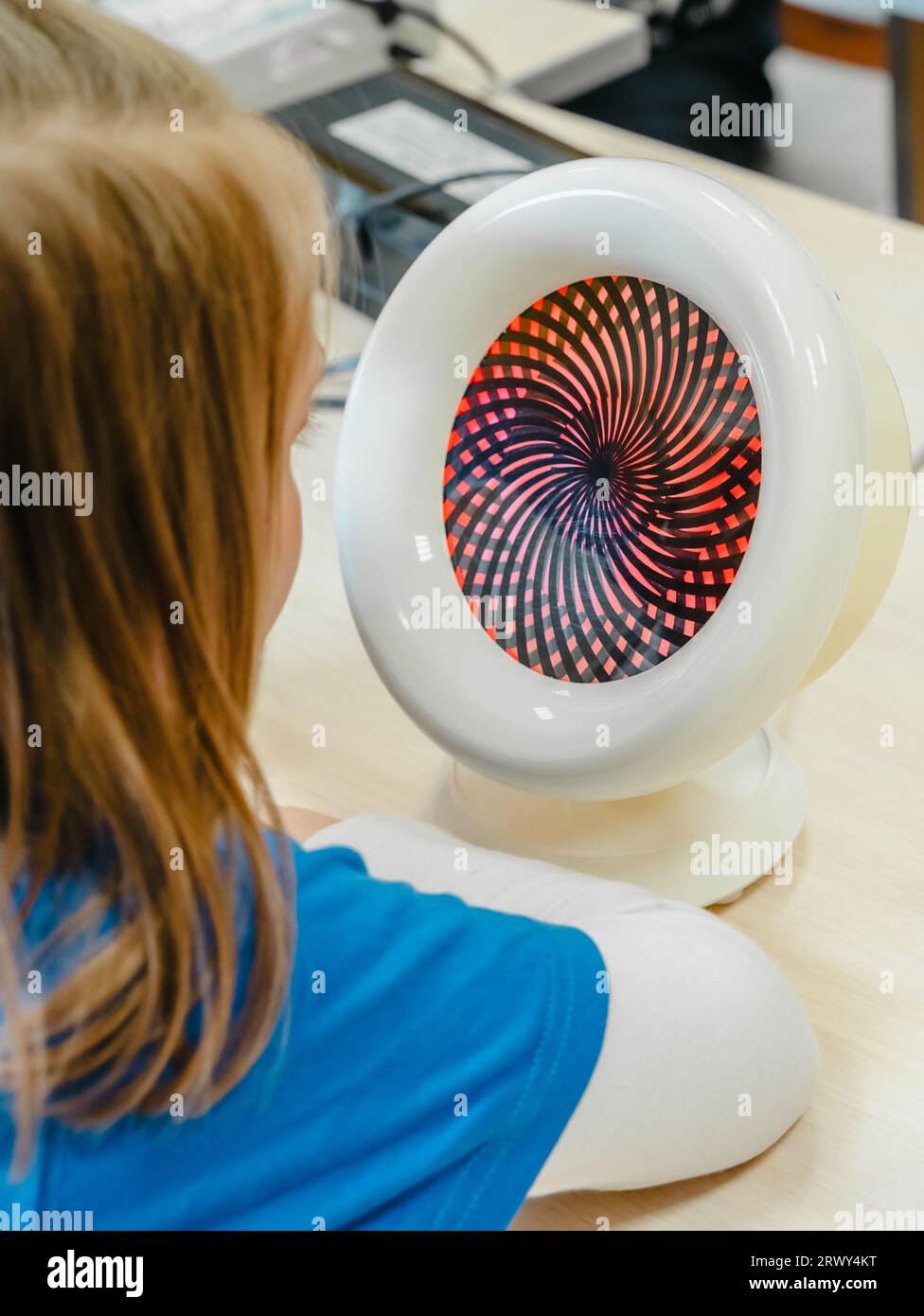 Little girl in medical office undergoing advanced laser vision ...