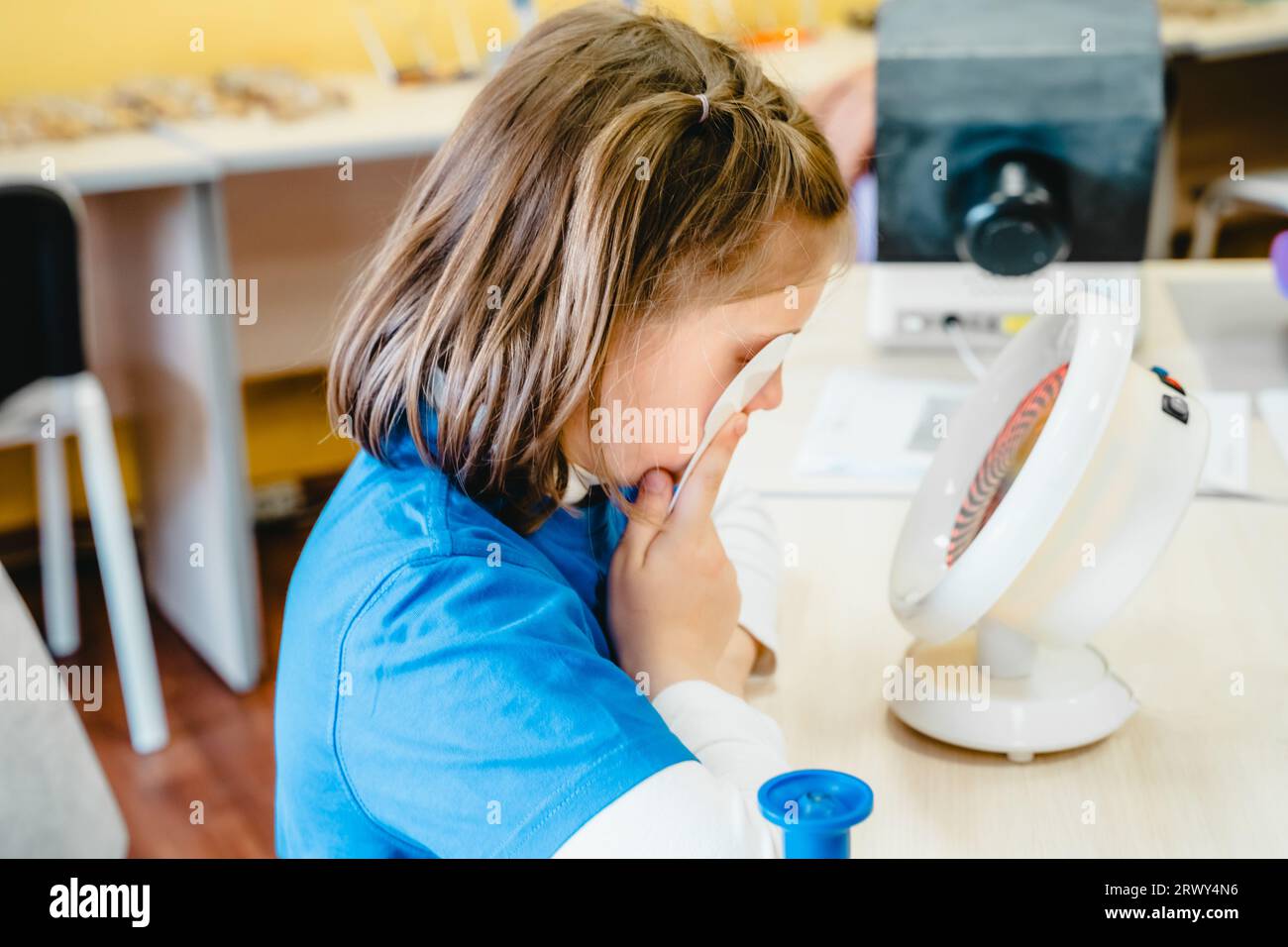 Little girl in medical office undergoing advanced laser vision ...