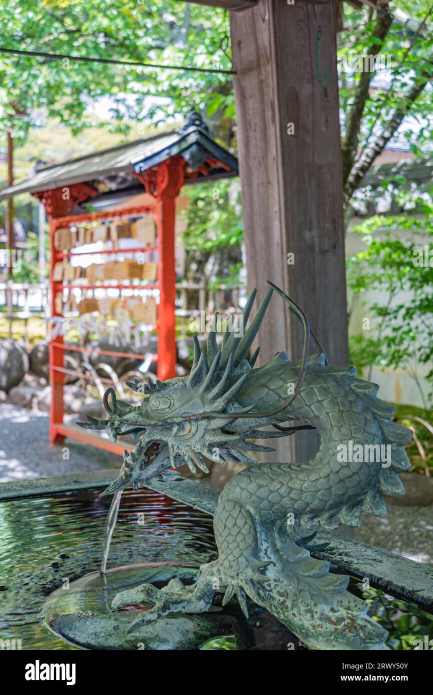 A waterhouse with a hot spring in the grounds of Izu Shuzenji Temple ...