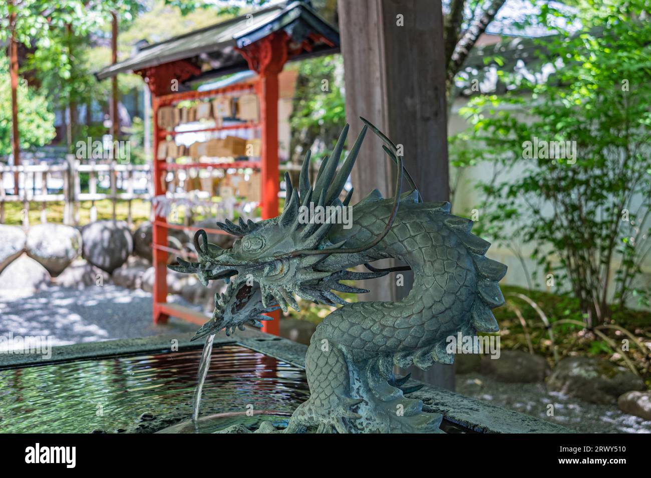 A waterhouse with a hot spring in the grounds of Izu Shuzenji Temple ...