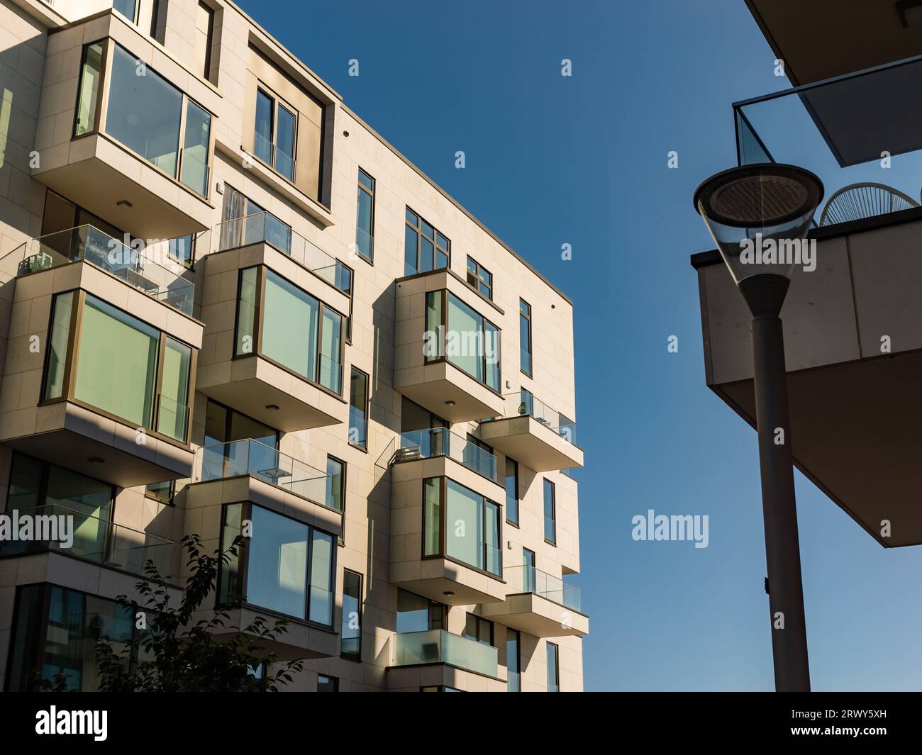 Modern apartment building in the city center. Cubic architecture with a ...