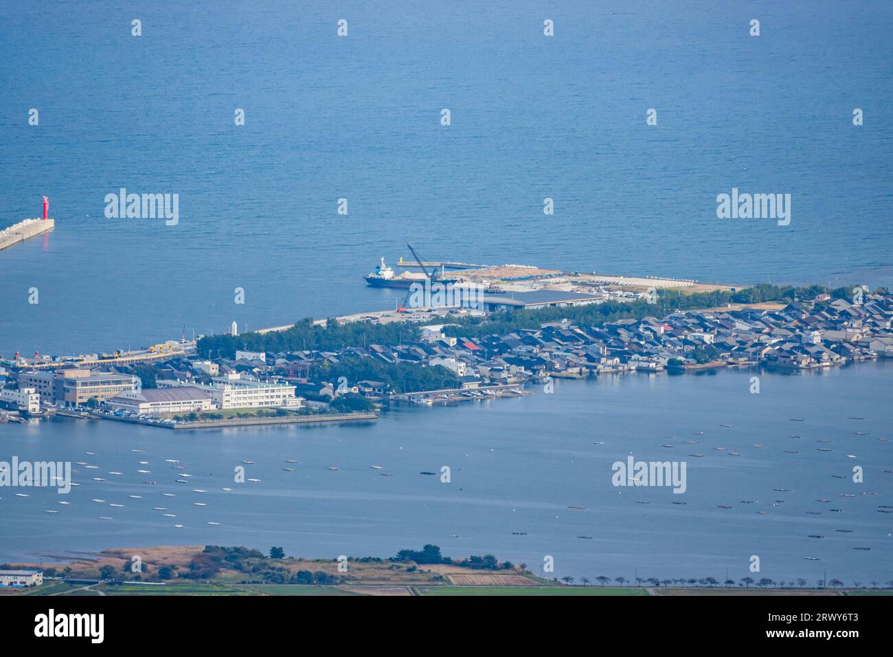 Sado Island Ryotsu Port cityscape seen from Koryu Center Hakuundai ...