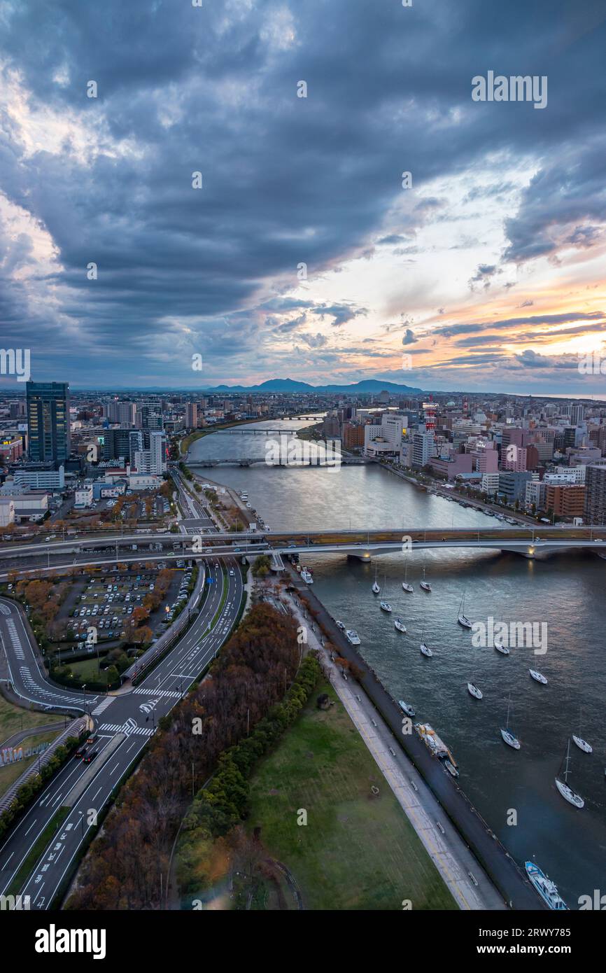 Beautiful sunset and the cityscape along the Niigata Shinano River ...