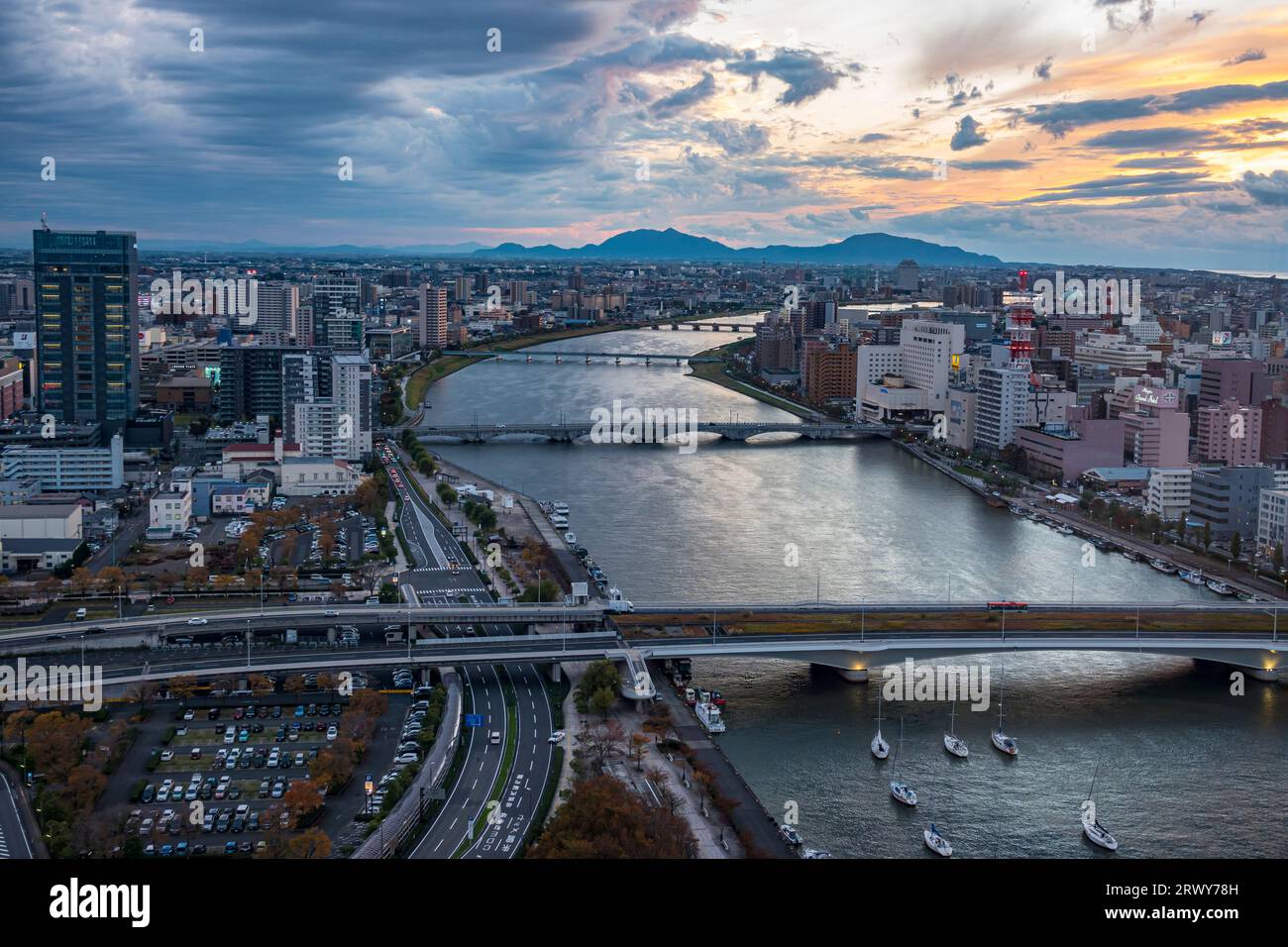 Beautiful sunset and the cityscape along the Niigata Shinano River ...