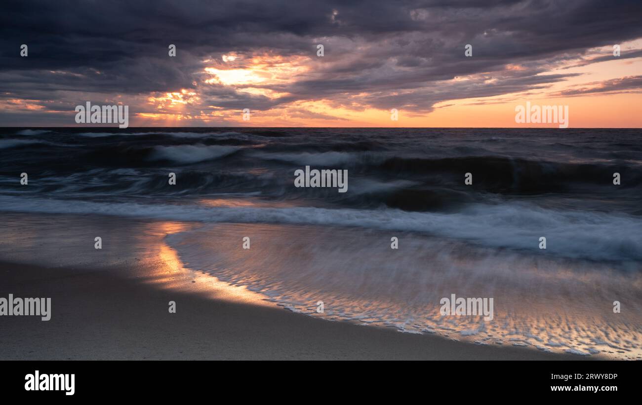sunset over the sea, long exposure, dramatic sky Stock Photo - Alamy