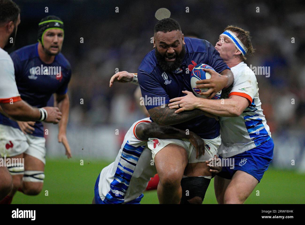 France's Uini Atonio is tackled by Namibia's Louis van der Westhuizen ...