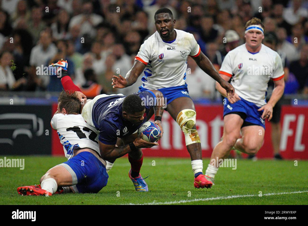 France's Jonathan Danty crashes over to score his side's fifth try ...