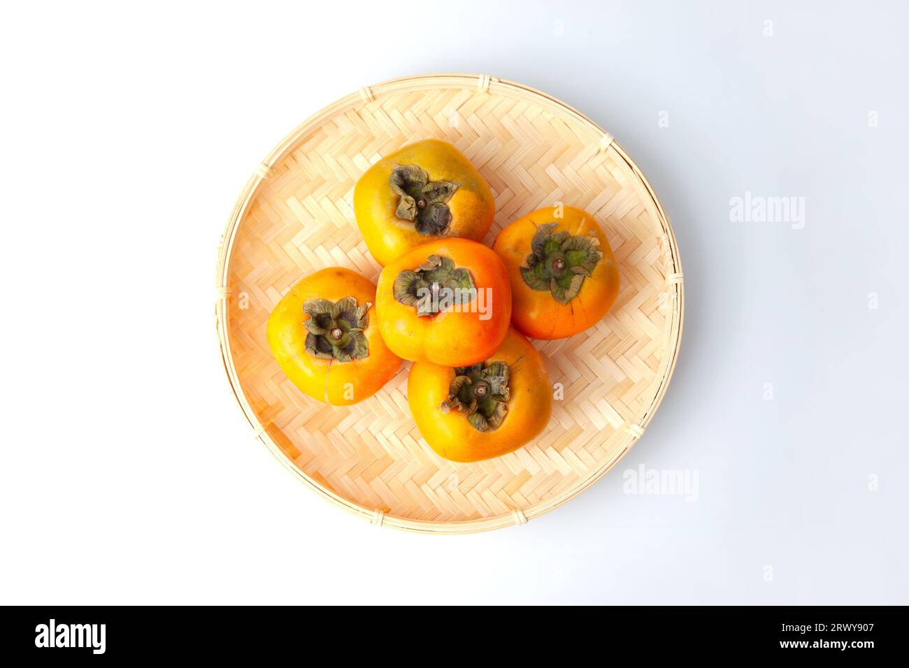 ripe persimmon isolated on white background Stock Photo - Alamy
