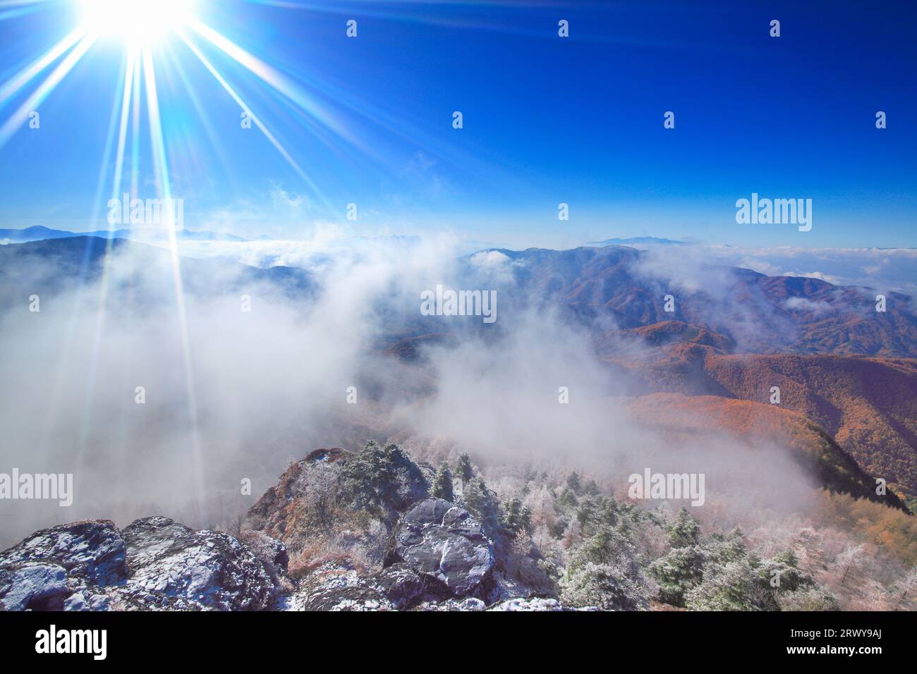 Morning sun, rising clouds, fresh snow on the rocky ridge of Oogahana ...