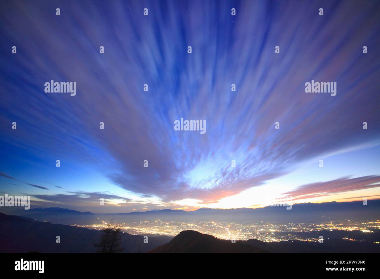 Central Alps and Northern Alps with flowing dusk clouds and night view ...