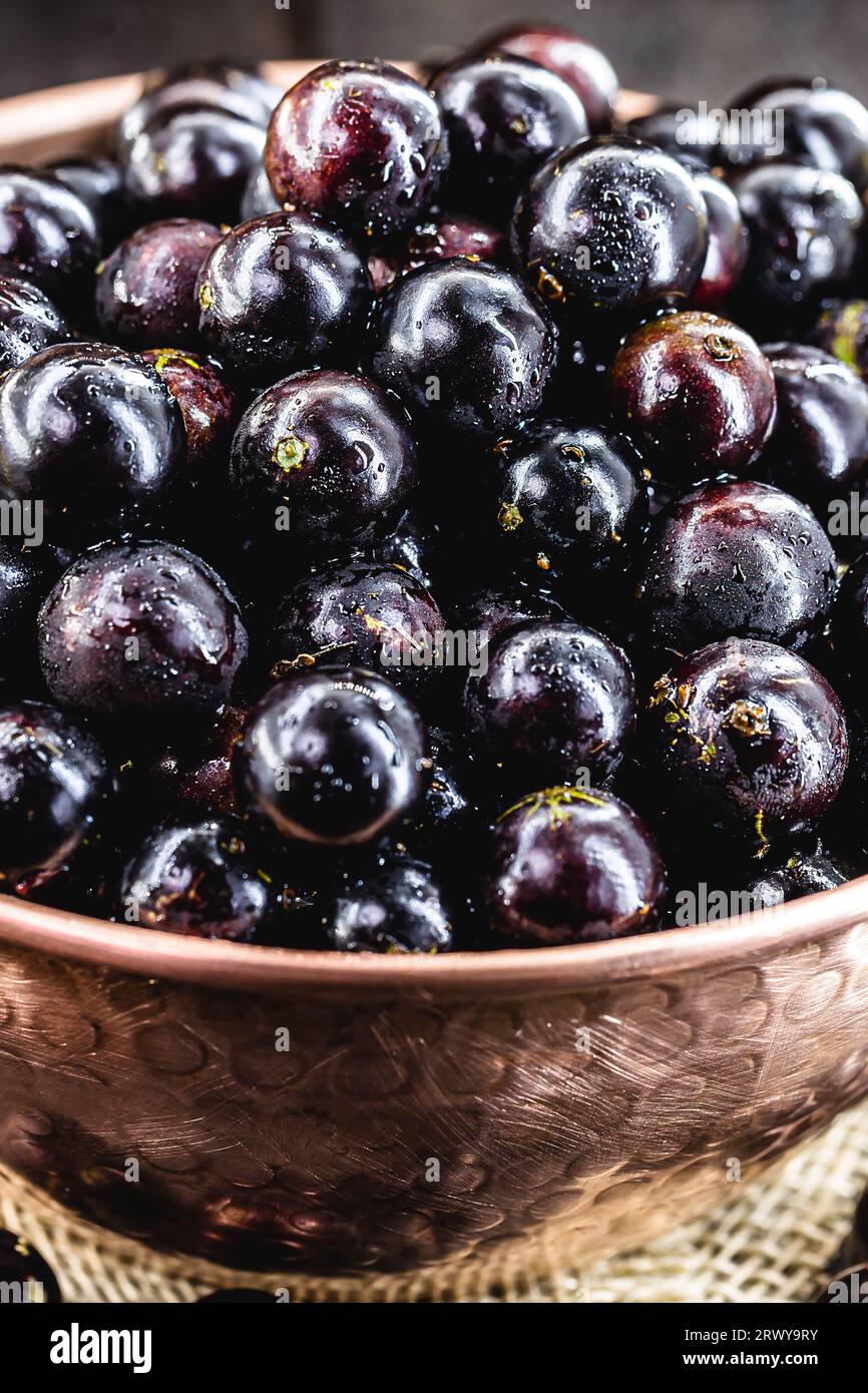 Jabuticaba. Brazilian and South American tropical fruits, in a copper ...