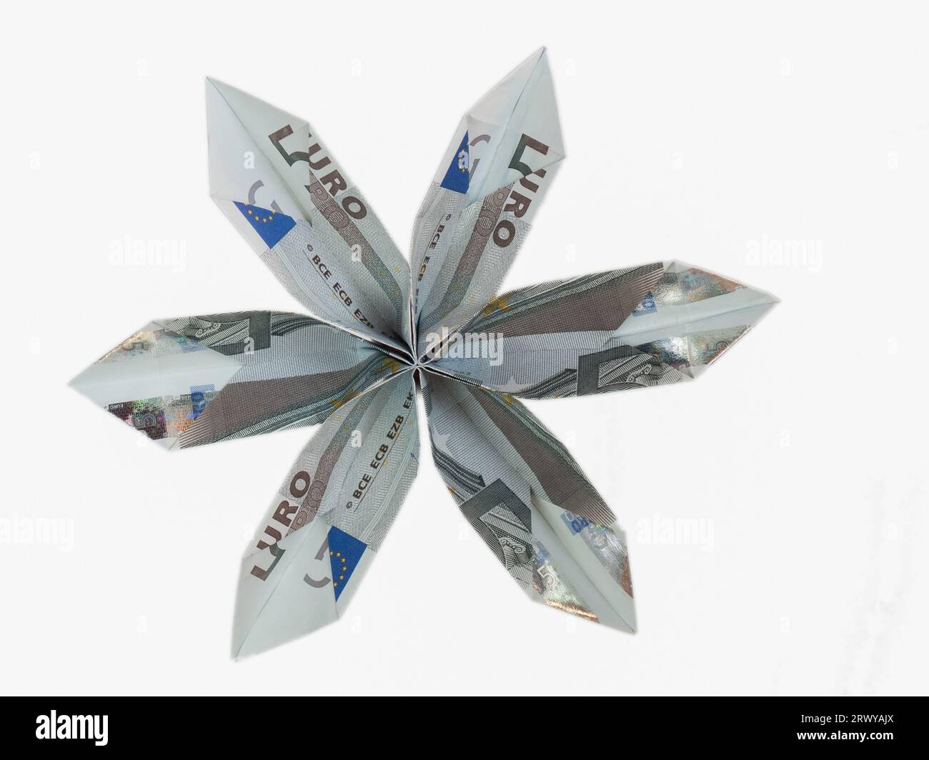 An origami flower of three fife euro notes folded Stock Photo - Alamy