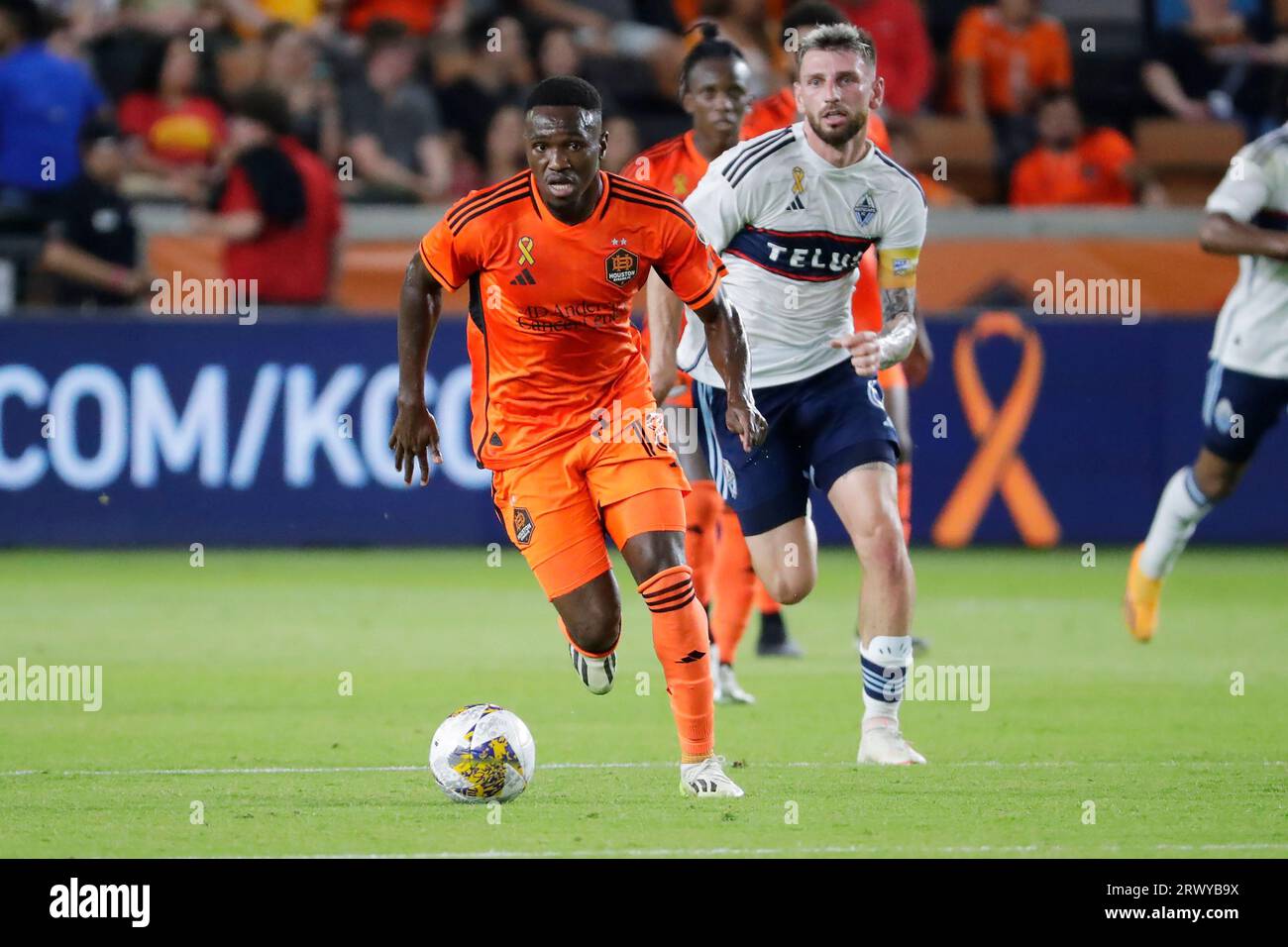 Houston Dynamo forward Ibrahim Aliyu, left, moves the ball in front of ...