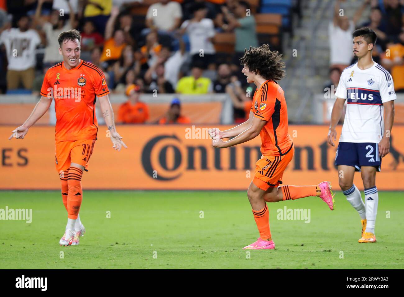 Houston Dynamo forward Corey Baird (11) and forward Ivan Franco, center ...