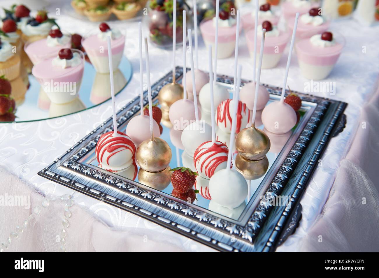 Delicious sweets of cake pops on a welcome buffet table Stock Photo - Alamy