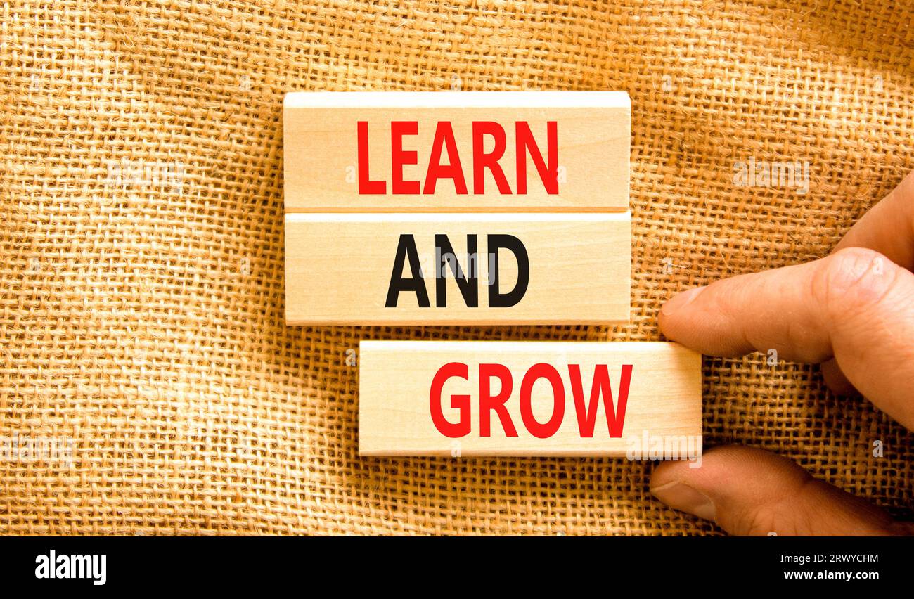 Learn and grow symbol. Concept word Learn And Grow on beautiful wooden ...