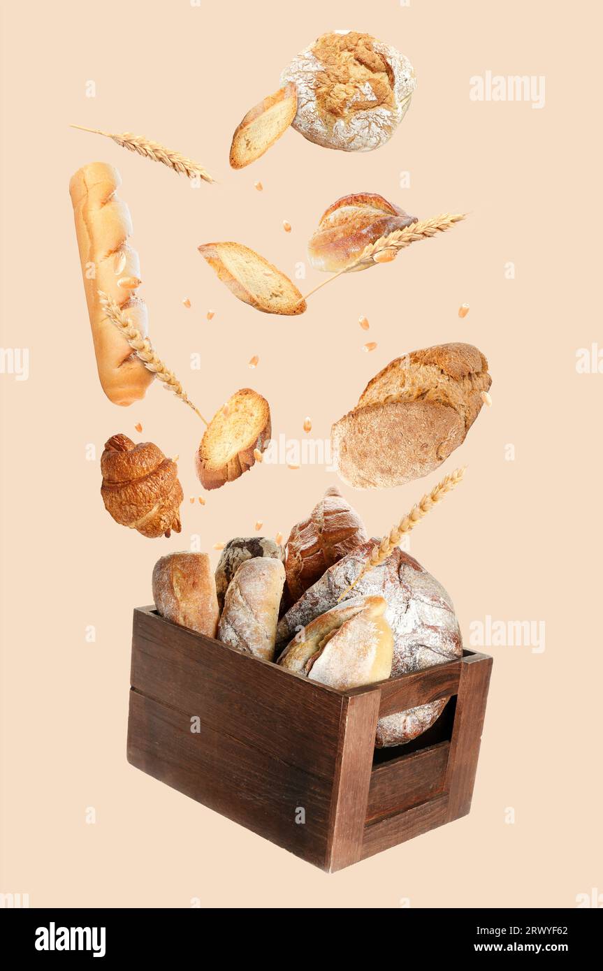 Flying box with different bakery products on beige background Stock ...