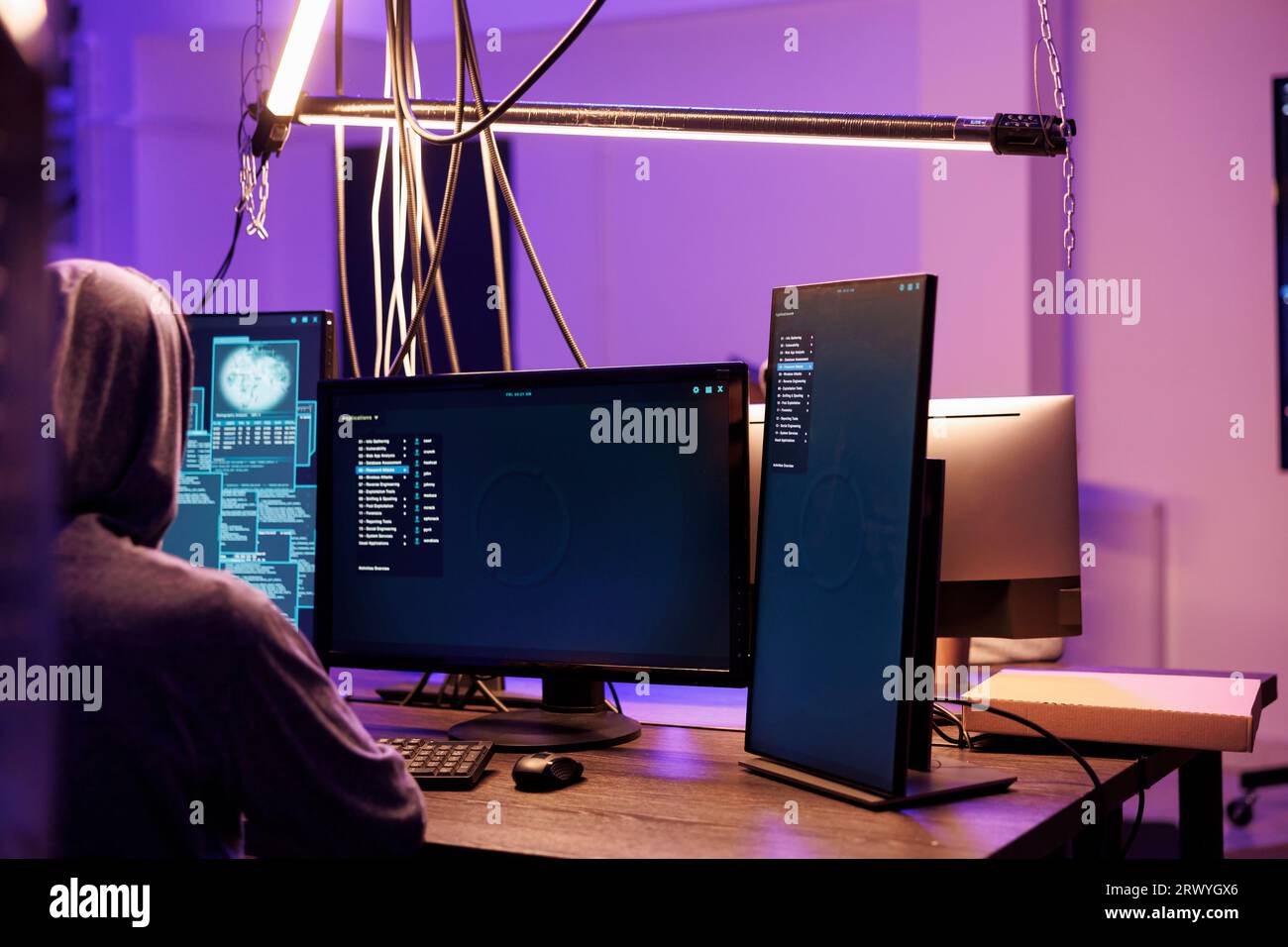 Hacker running malicious software on screen for cracking password ...