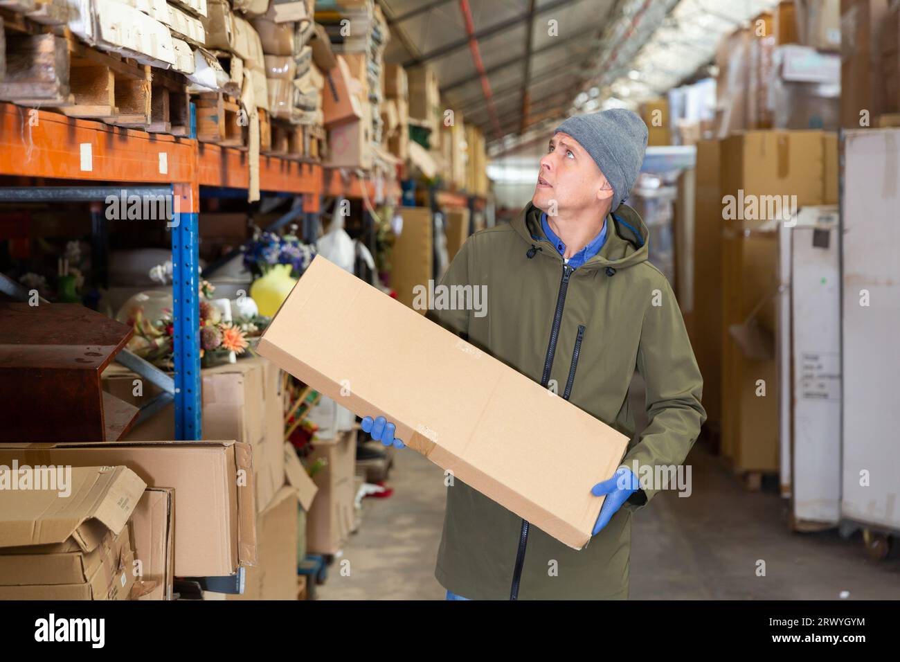 Man carrying loader goods hi-res stock photography and images - Alamy