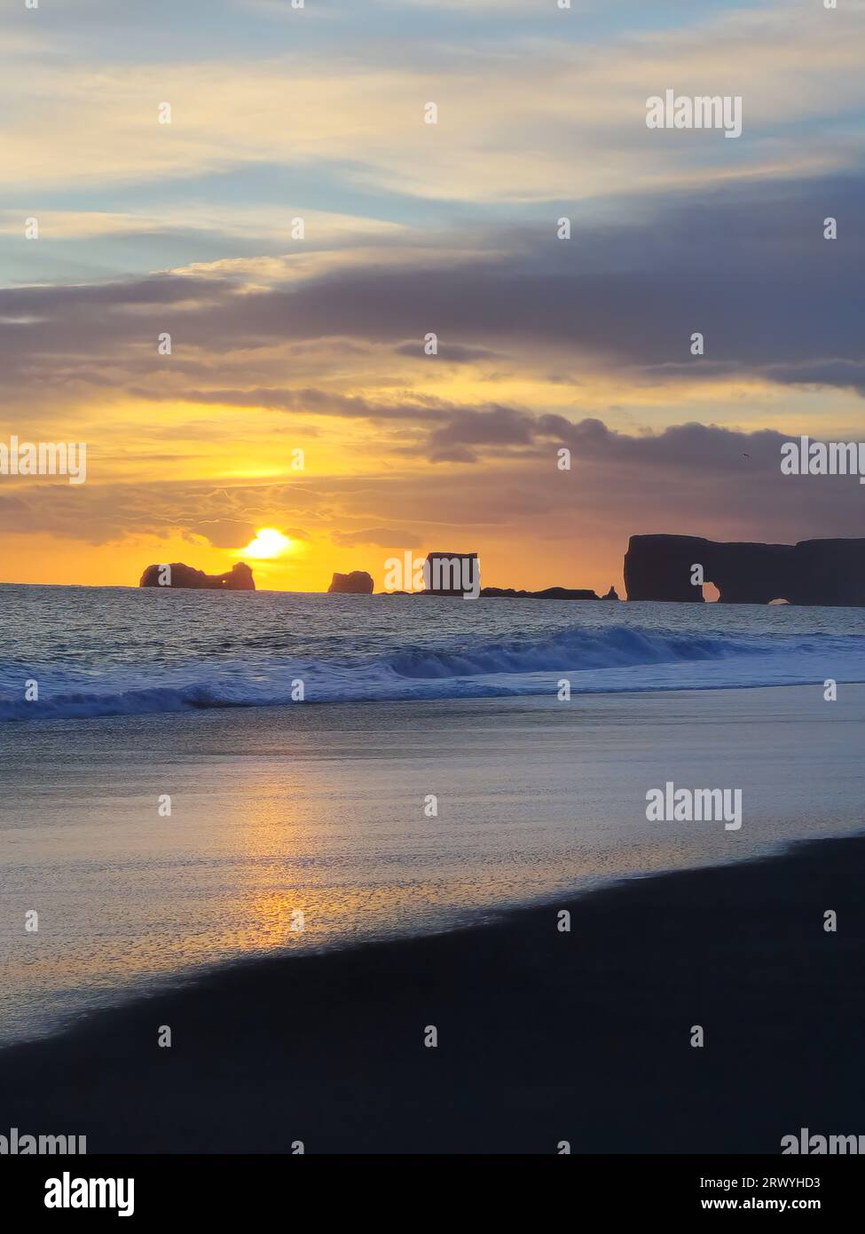 Fantastic northern scene with golden light from sunset, oceanfront ...