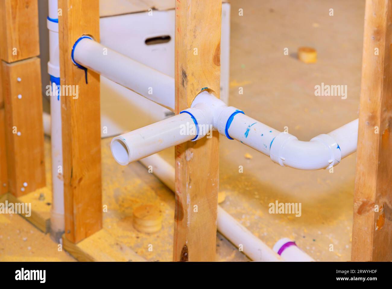New house construction installing PVC drainage system in wall Stock ...