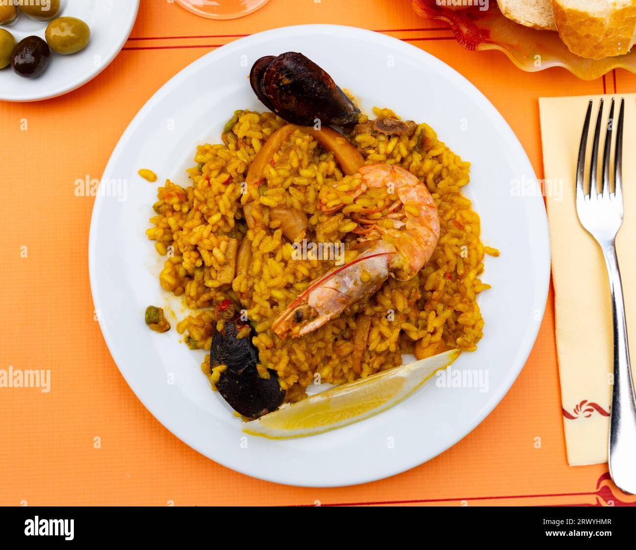 Valencian paella is mixture of chicken and seafood Stock Photo - Alamy