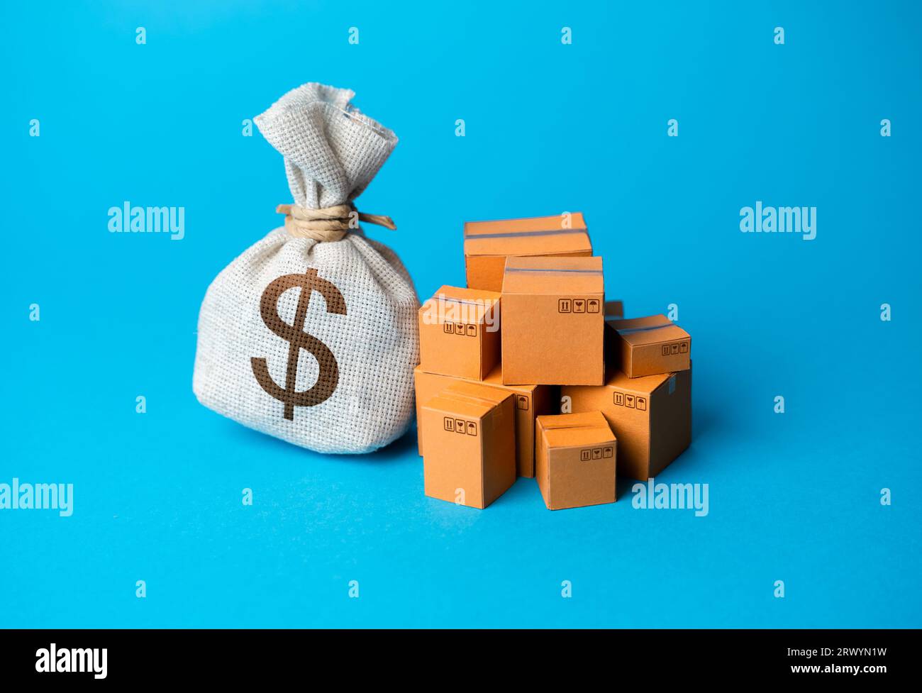 Goods boxes and dollar money bag. Efficient logistics and distribution ...