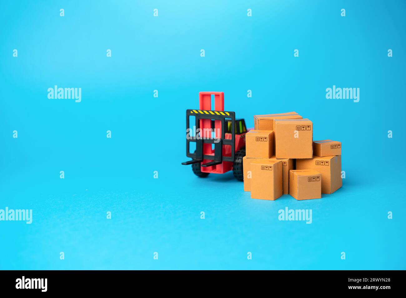 Boxes of goods and forklift. Warehouses, manufacturing facilities, and ...