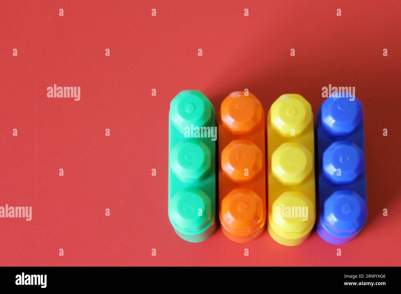 Pieces of plastic rainbow multicolored buildable toy blocks formed and ...