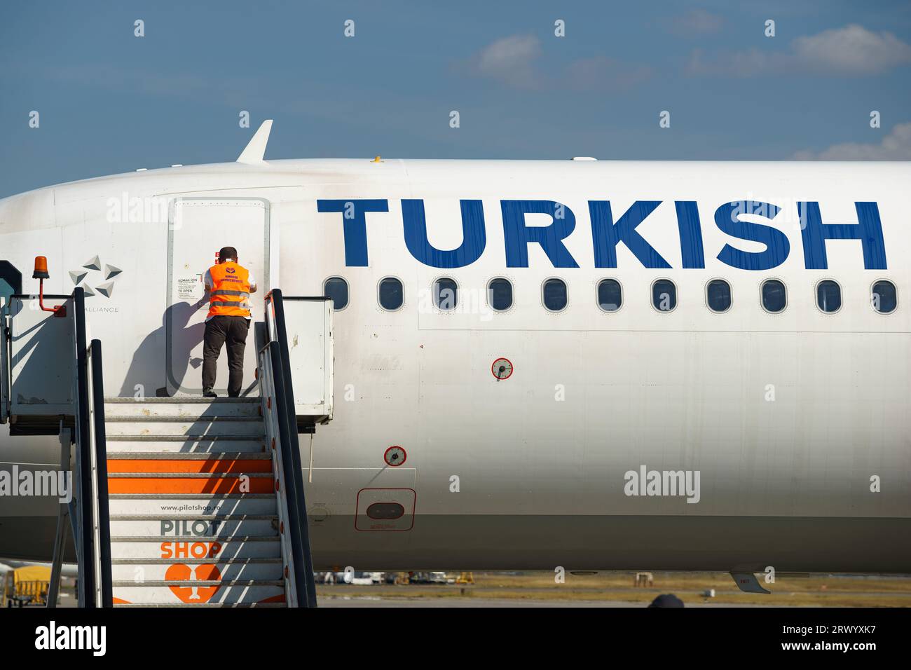 Bucharest, Romania. 21st Sep, 2023: A ramp agent secures the ladder of ...