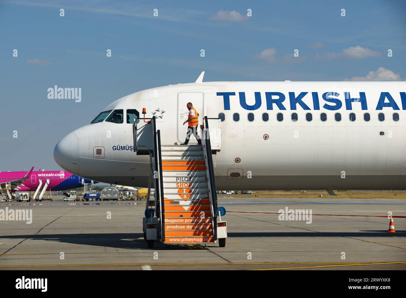 Bucharest, Romania. 21st Sep, 2023: A ramp agent secures the ladder of ...