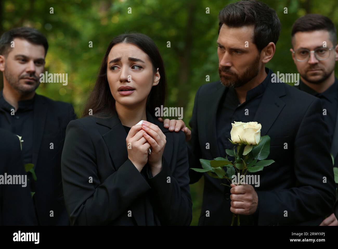 Funeral ceremony. Sad people in black clothes mourning outdoors Stock ...
