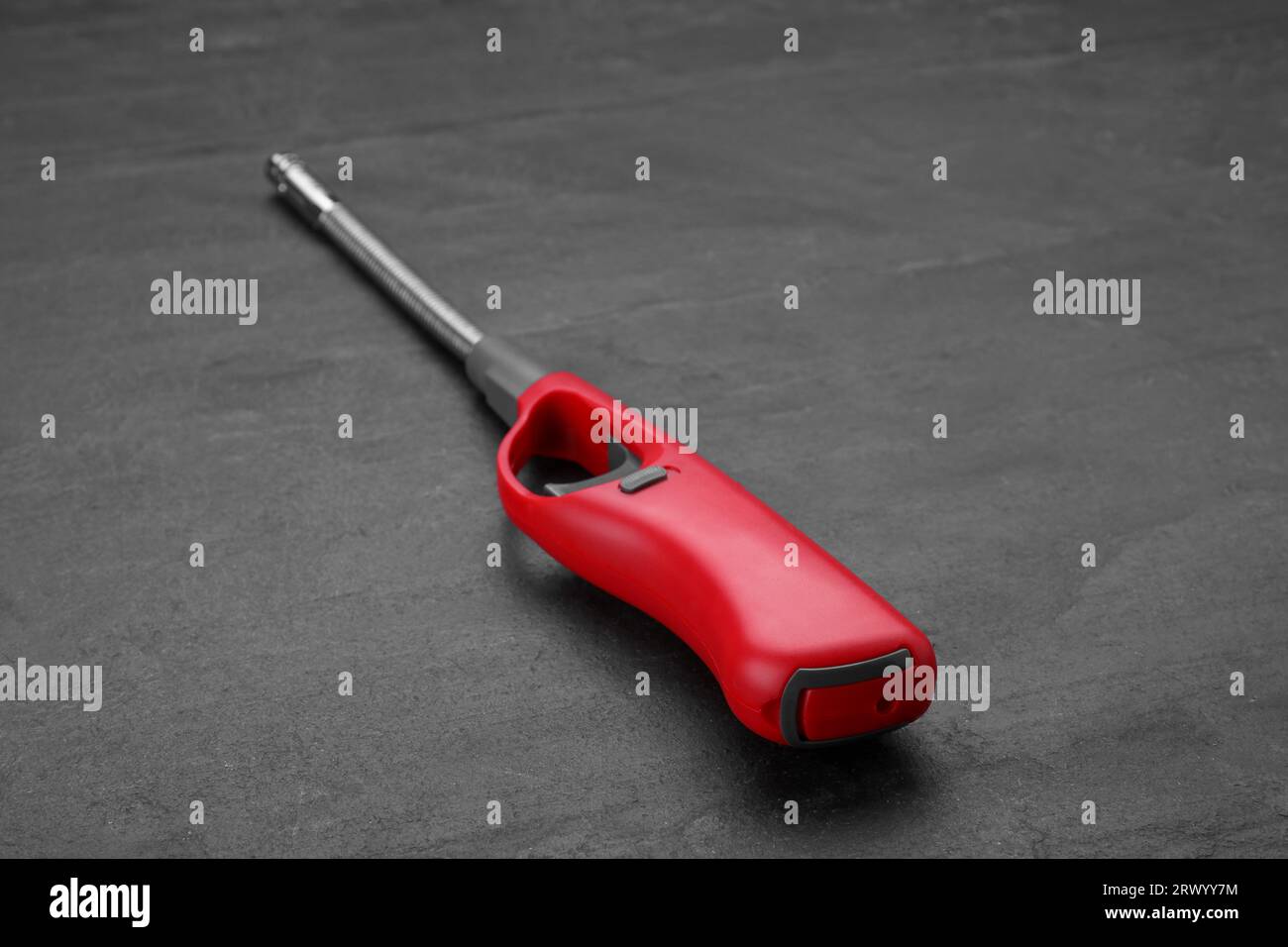 One gas lighter on black textured background Stock Photo - Alamy