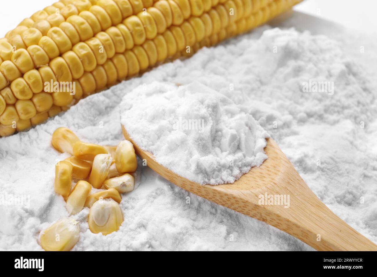 White corn starch, ripe cob and kernels on powder, closeup Stock Photo ...