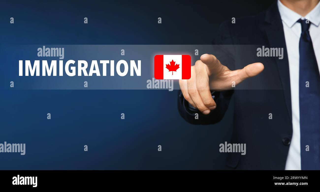 Immigration. Businessman touching digital screen with word and flag of ...