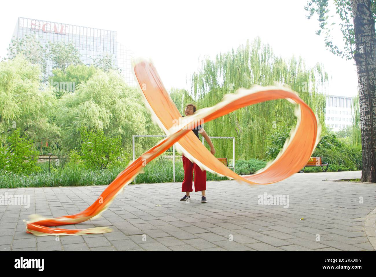 Beijing, China - July 22, 2022: Lady with ribbons in Khanbaliq City ...