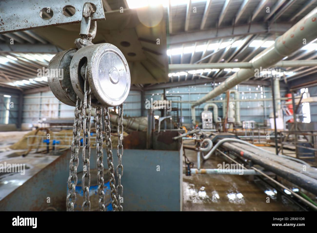 Crane slings on a production line Stock Photo - Alamy