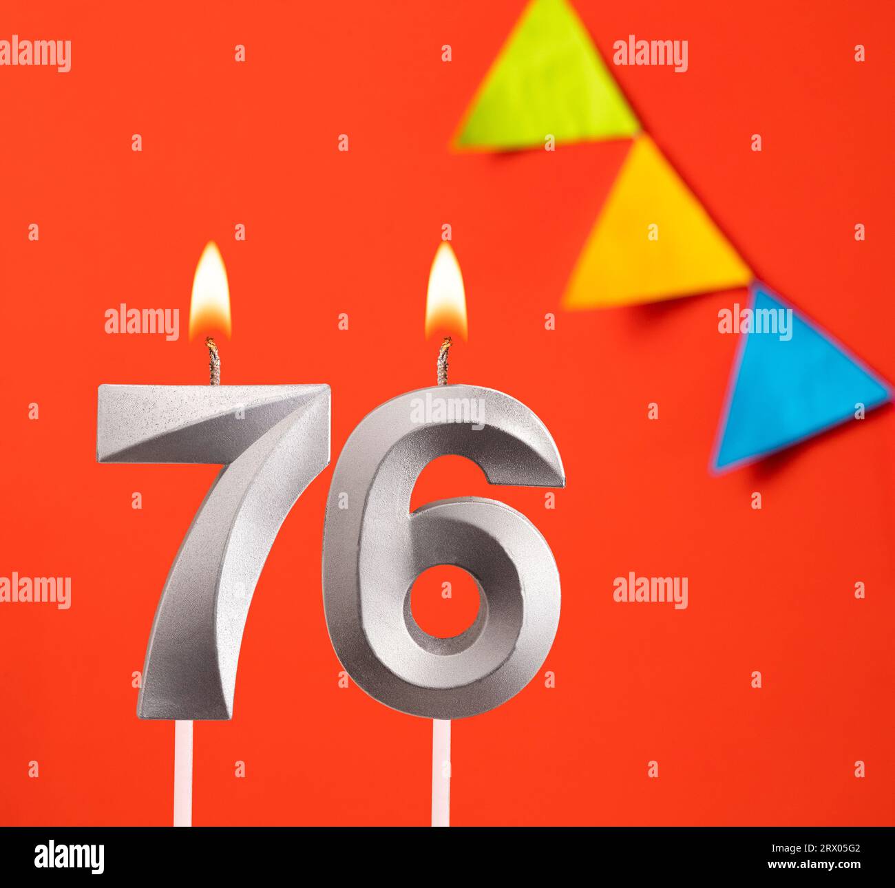 Birthday card - Number 76 candle in orange background Stock Photo - Alamy