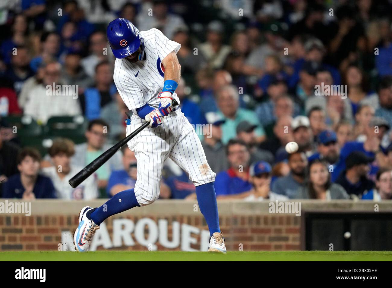 Chicago Cubs' Dansby Swanson swings into an RBI single off Pittsburgh ...