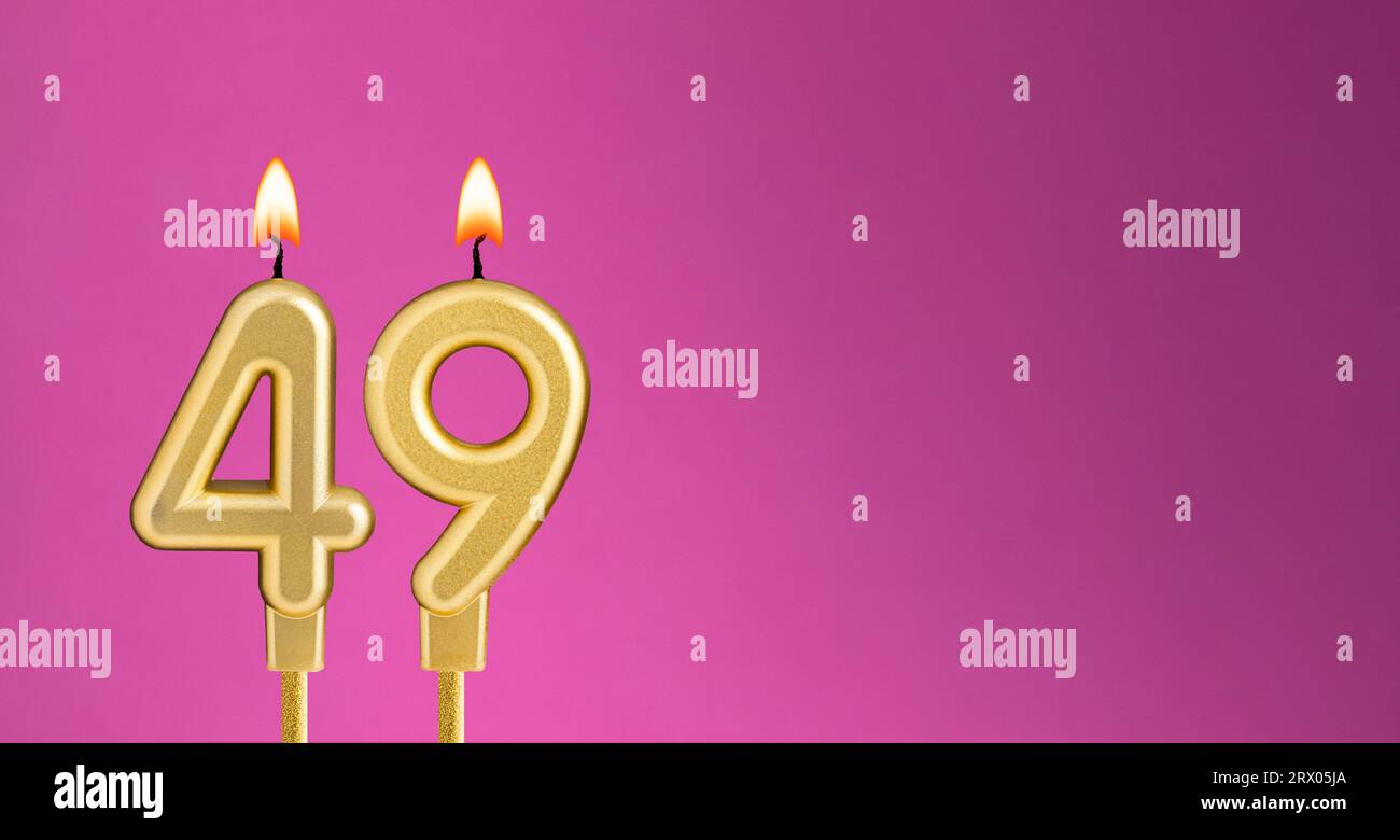 Candle number 49 in purple background - birthday card Stock Photo - Alamy