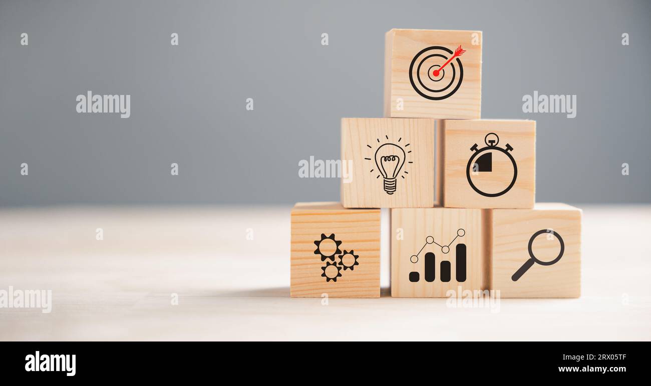 Wooden block cude step on table with Action Plan Stock Photo - Alamy