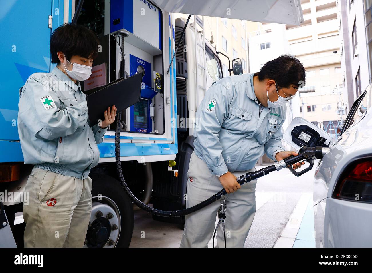 Osaka, Japan. 21st Sep, 2023. Staff members give a service to a Toyota ...