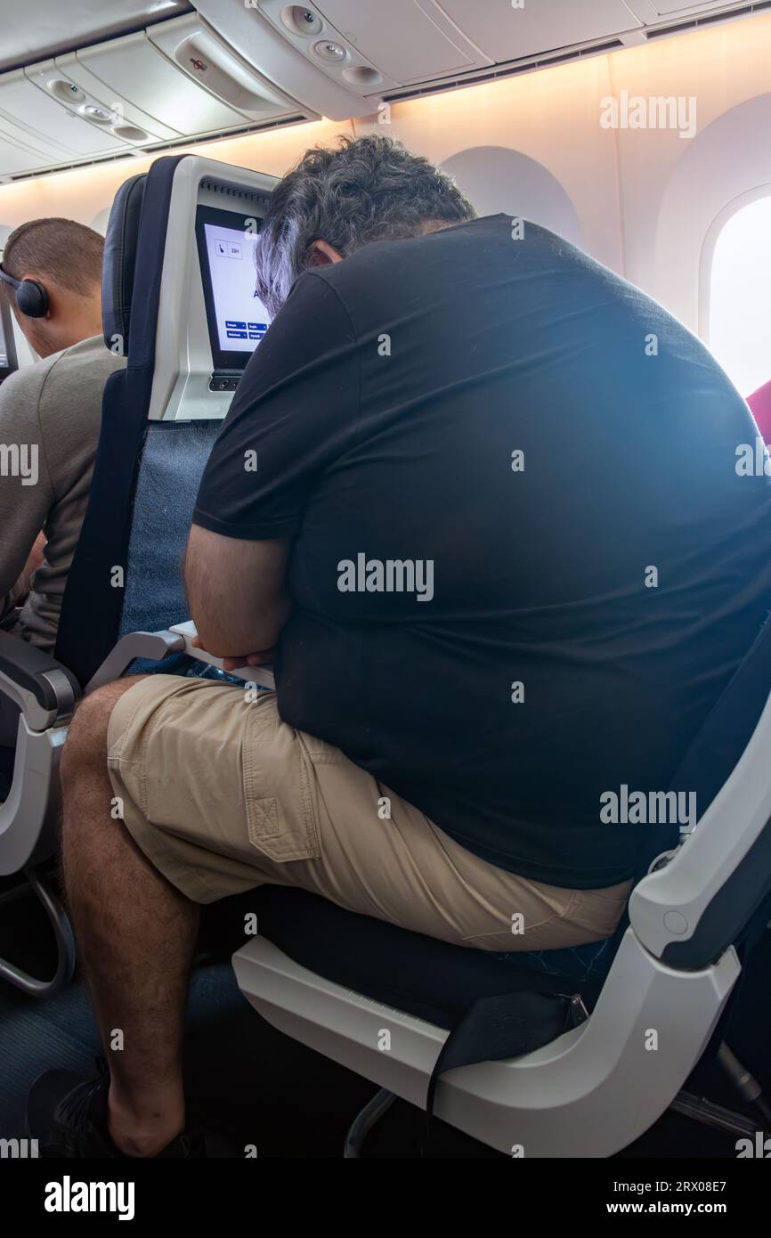 Overweight plane passenger hi-res stock photography and images - Alamy