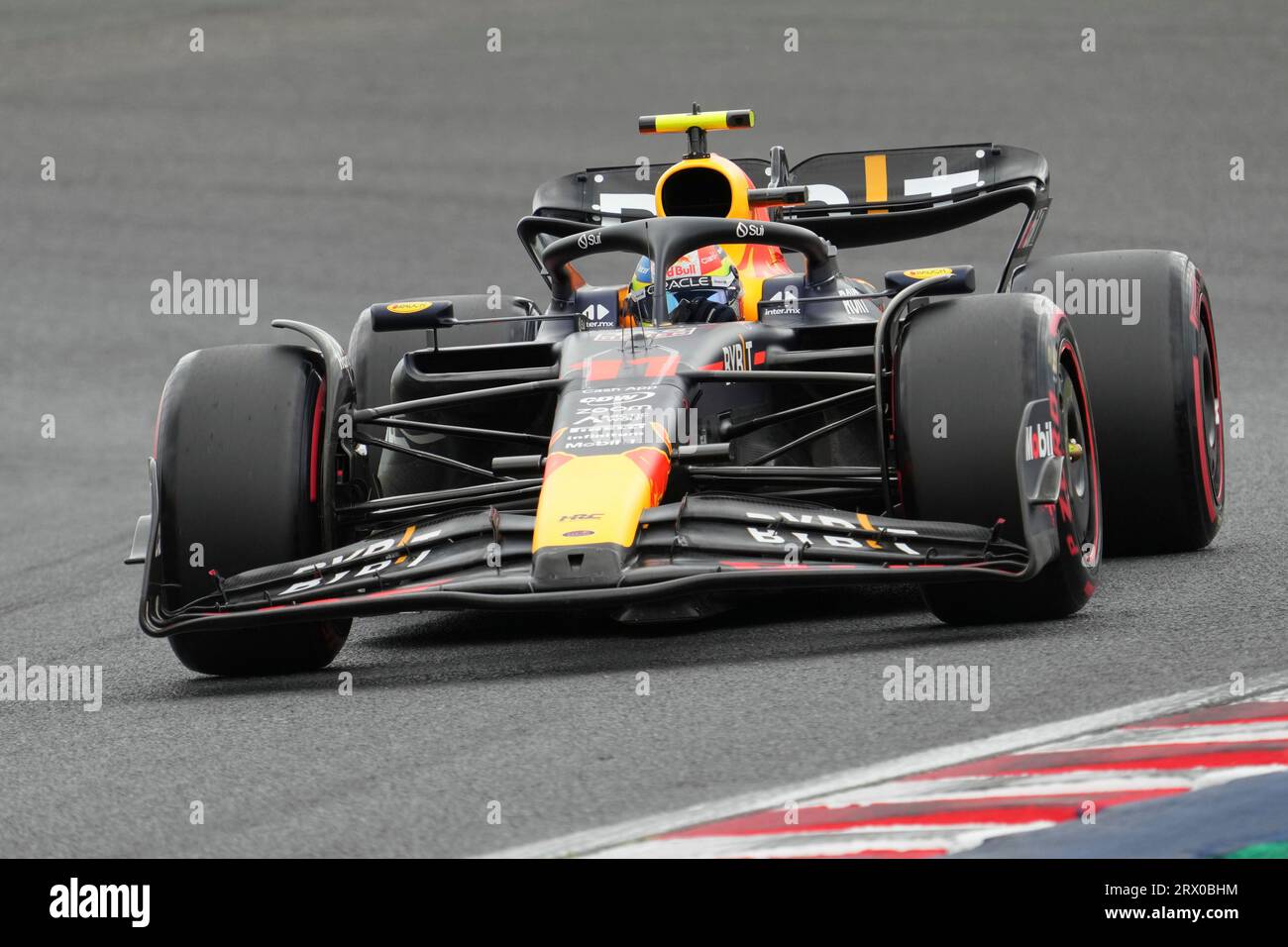 Red Bull driver Sergio Perez of Mexico steers his car during the first practice ahead of the ...