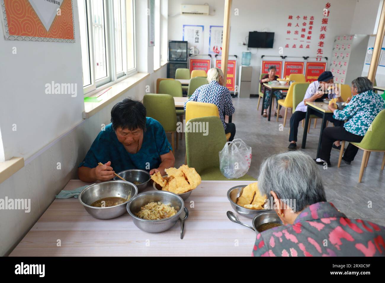 Luannan County, China - August 9, 2023: Elderly people living alone eat ...