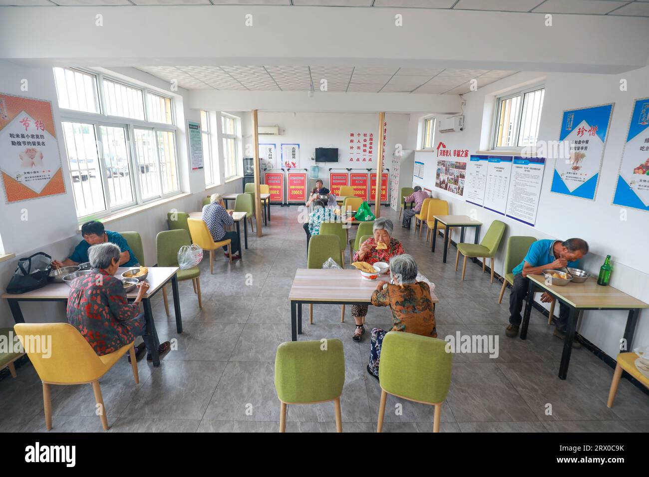 Luannan County, China - August 9, 2023: Elderly people living alone eat in small canteens in ...
