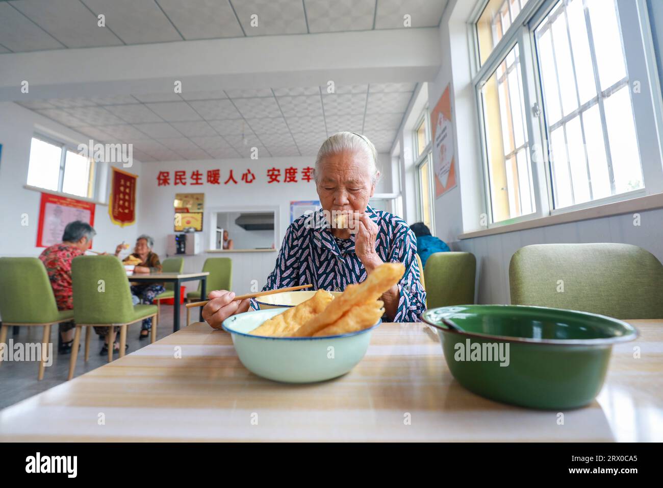 Luannan County, China - August 9, 2023: Elderly people living alone eat ...