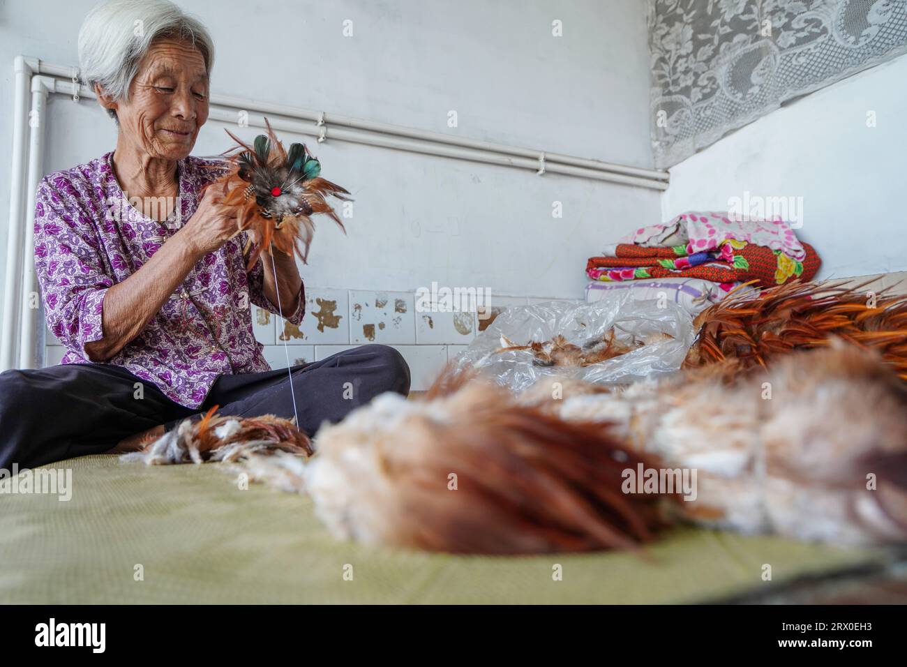 Luannan County, China - August 24, 2022: A rural woman is making a ...